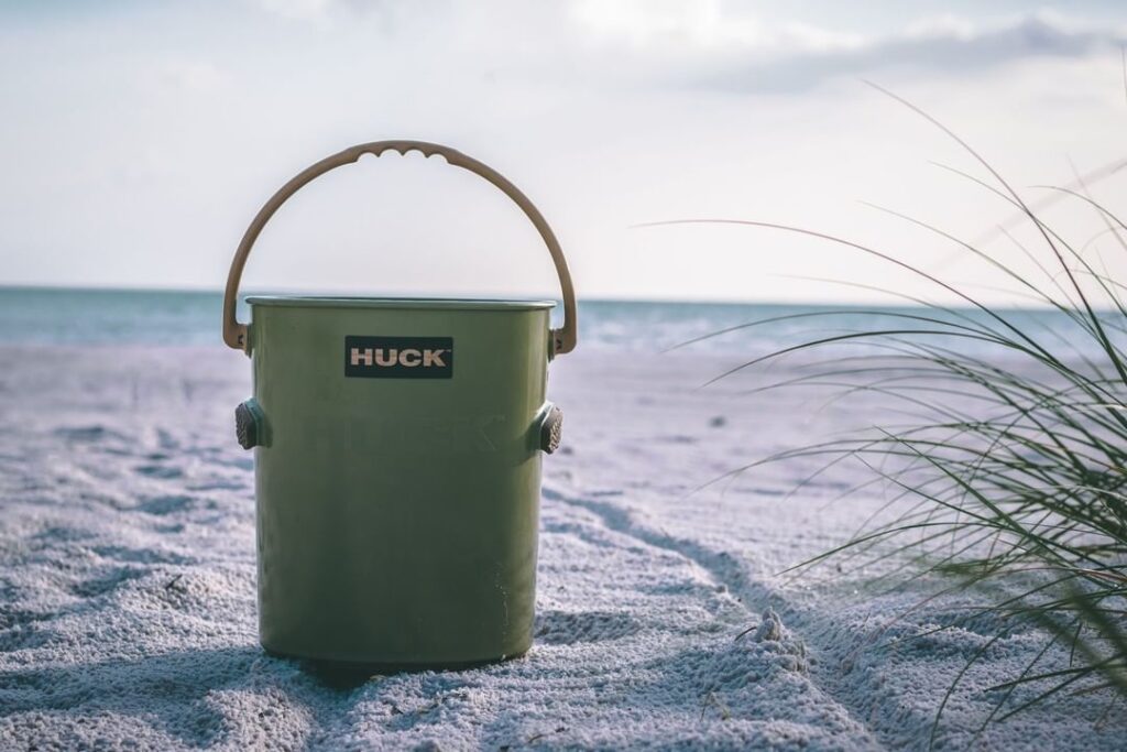 huck-bucket-green-on-beach - Hunting Waterfalls