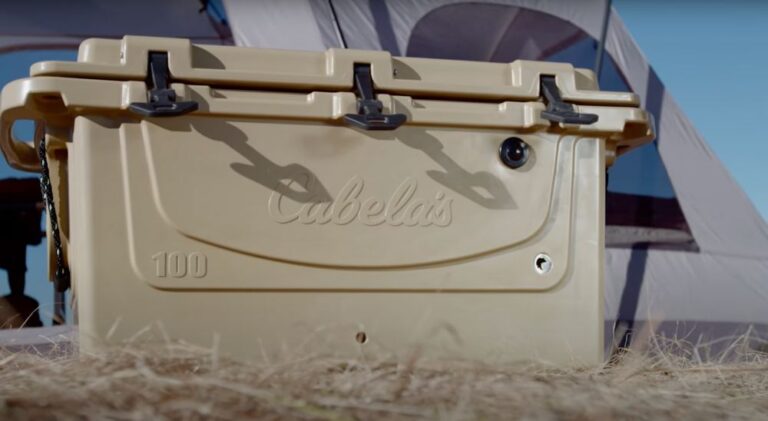 cabelas-cooler-tan-at-campground-tent-in-background - Hunting Waterfalls