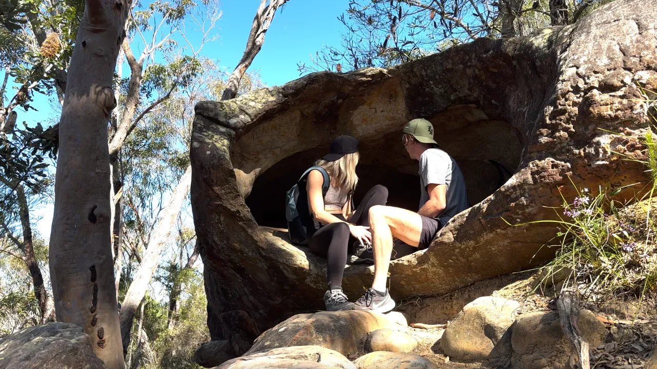 karloo-pools-track-little-cave-on-side-of-path-couple-sitting-in-it ...